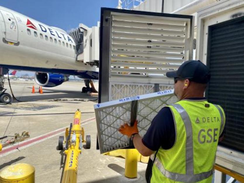 Delta GSE employee with air filter | Delta News Hub